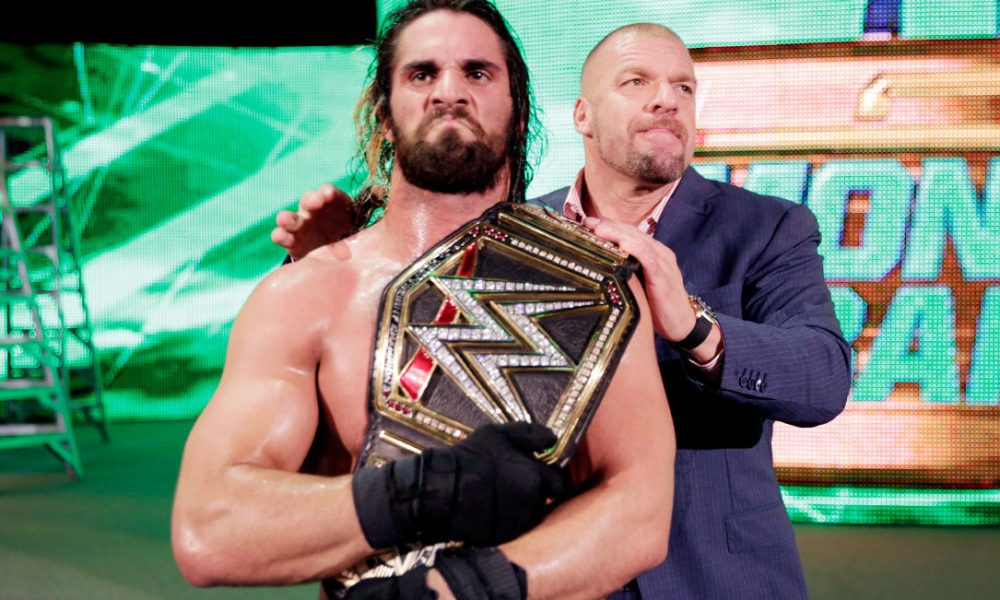 Triple H crowns Seth Rollins with WWE World Heavyweight Belt following ...
